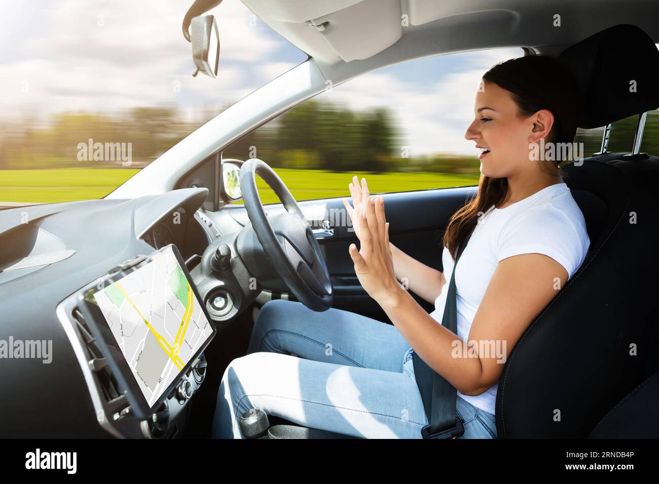 Side View Of A Young Woman Sitting In Self Driving Modern Car Stock ...