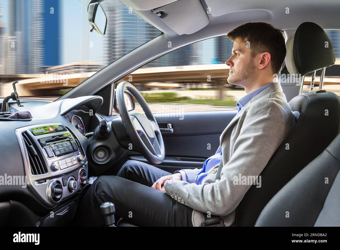 Side View Of A Young Man Sitting Inside Autonomous Car Stock Photo - Alamy