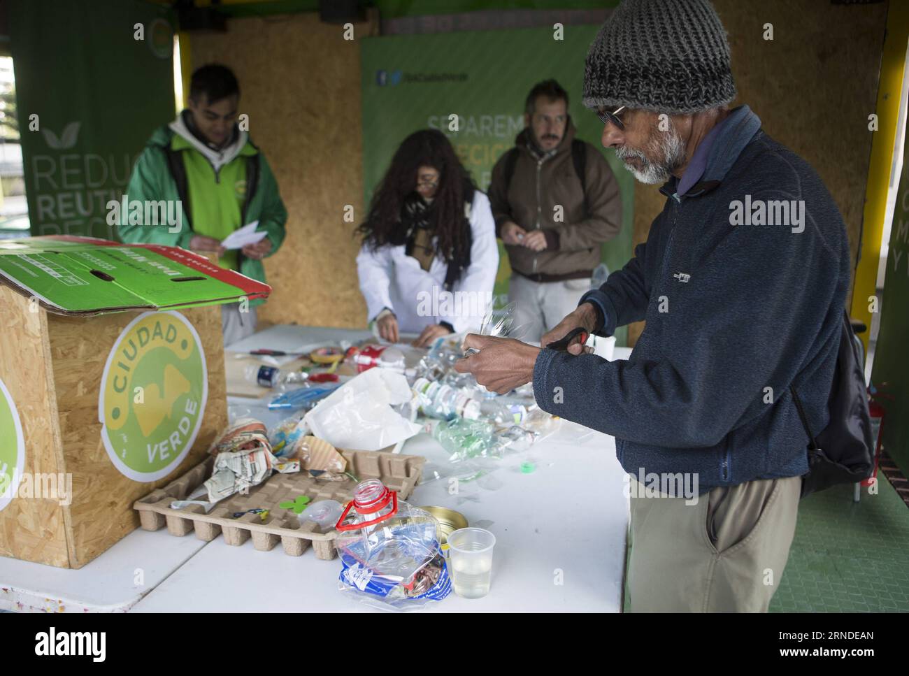 People make a three-dimensional mural with recyclable materials to ...