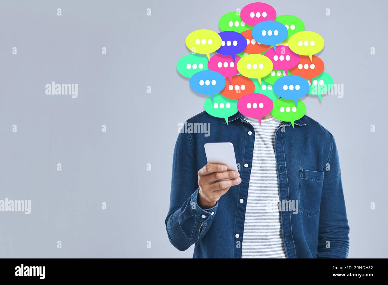 Social media, man and speech bubble with phone in studio, gray ...