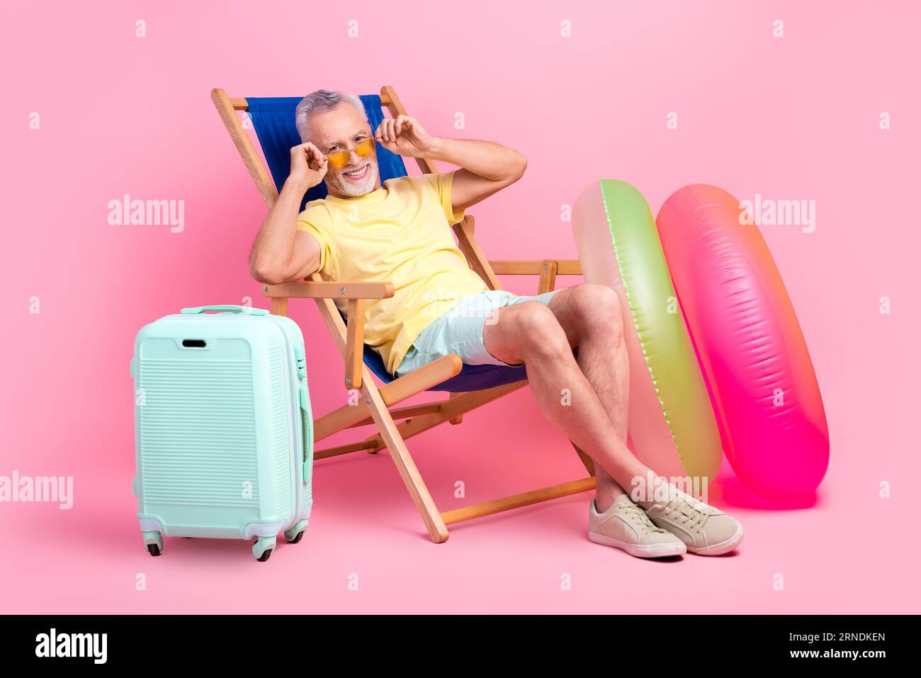 Full body length cadre of retired man lying sunbed mallorca country ...