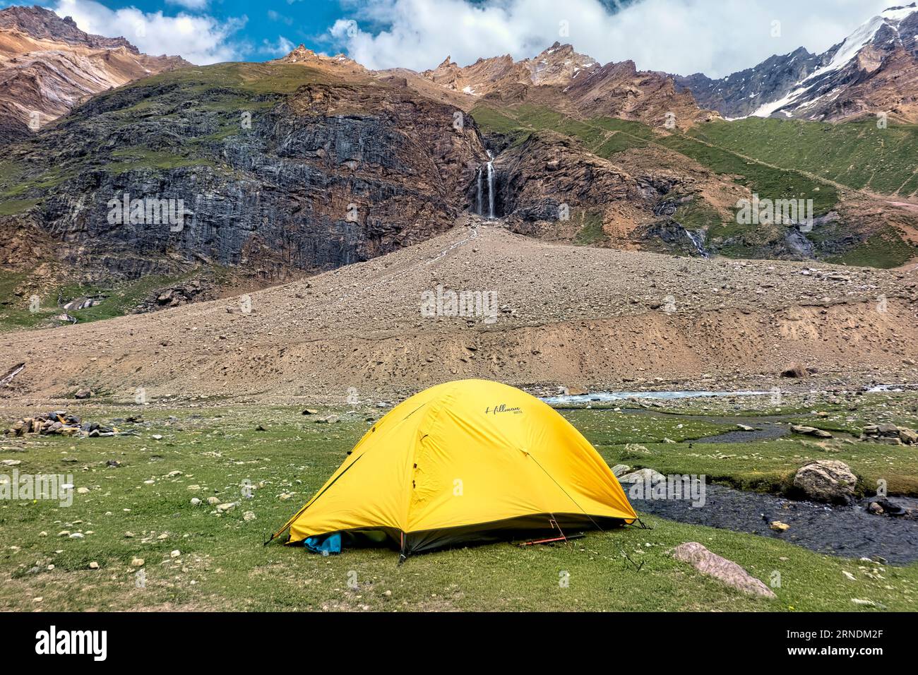 Waterfall and mountains camp below the Lomvilad Pass, Warwan Valley ...