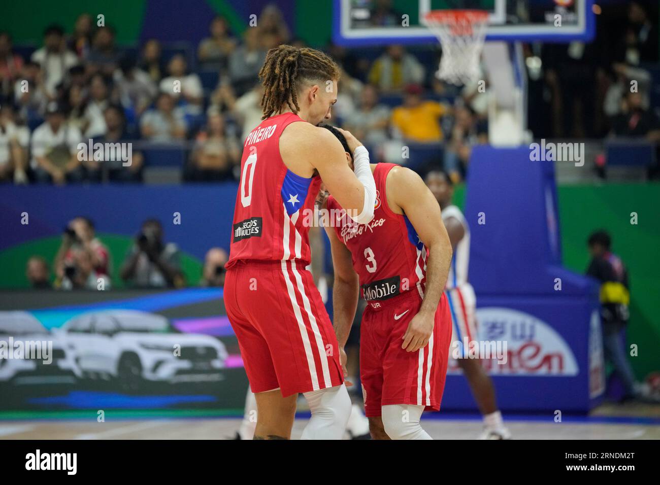 Puerto Rico forward Isaiah Pineiro (0) and Jordan Howard (3) react ...