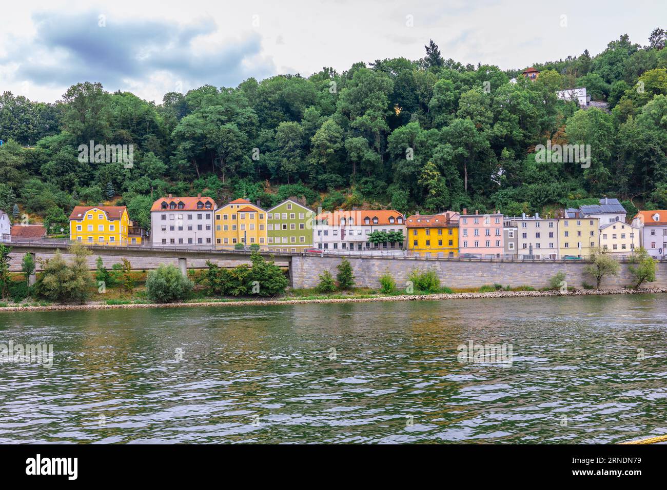 Panoramic view of colorful row of houses at river Danube, Passau ...
