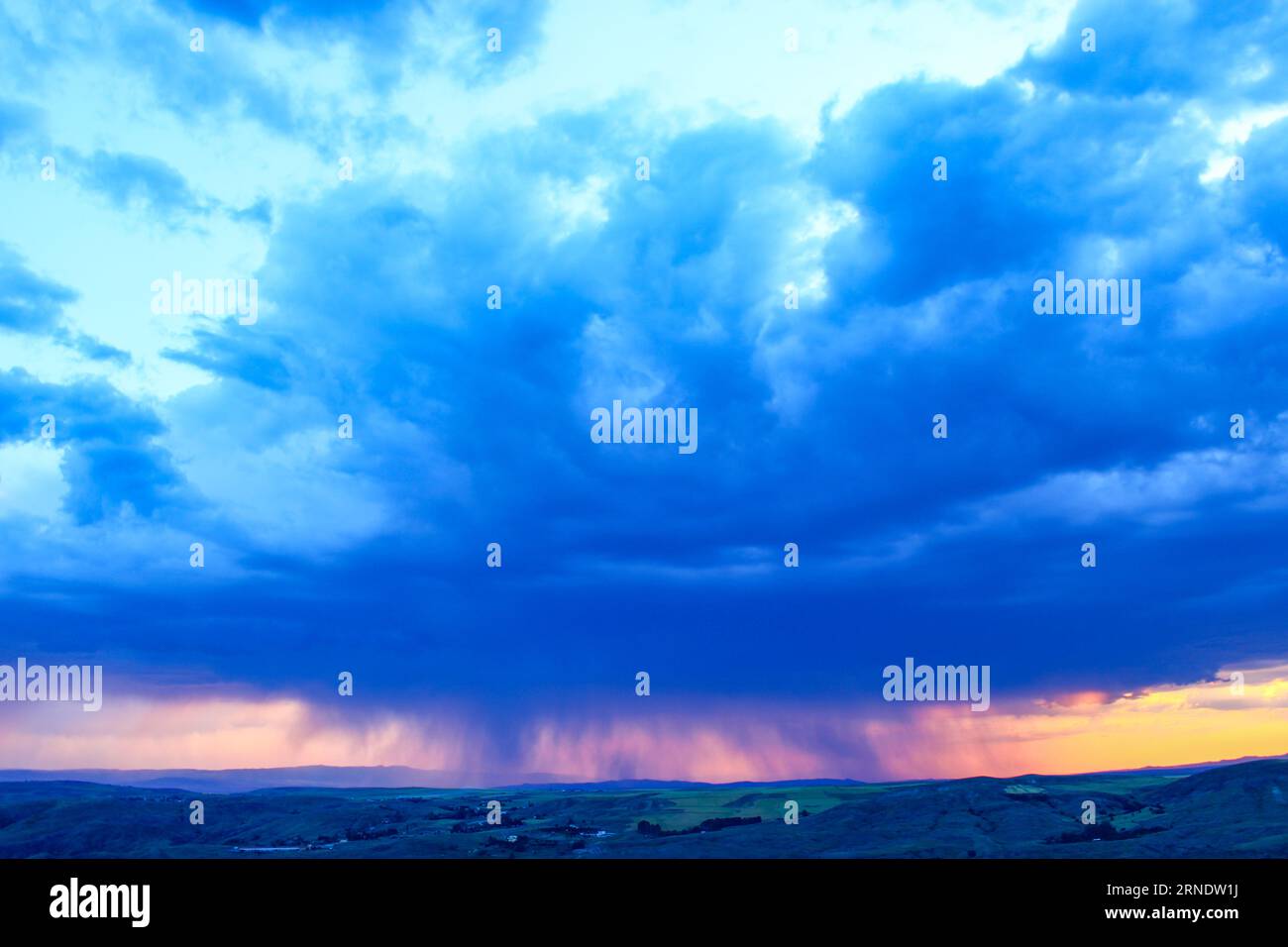 Cumulus clouds and different color tones in the sky at sunset. Dance of ...