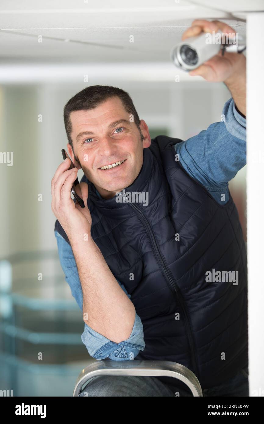 Installing security camera hi-res stock photography and images - Alamy