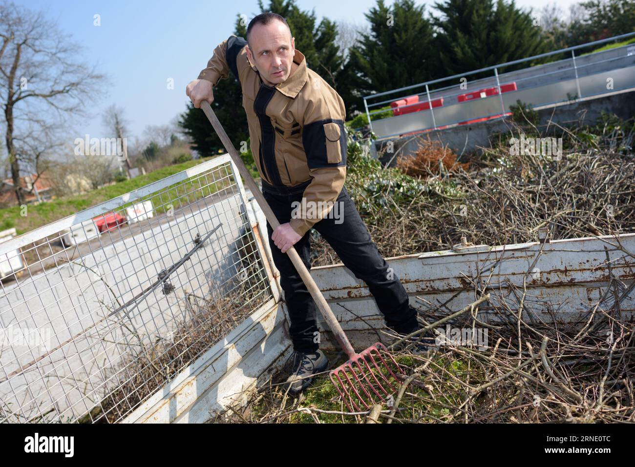 Man standing in grass rake hi-res stock photography and images - Alamy