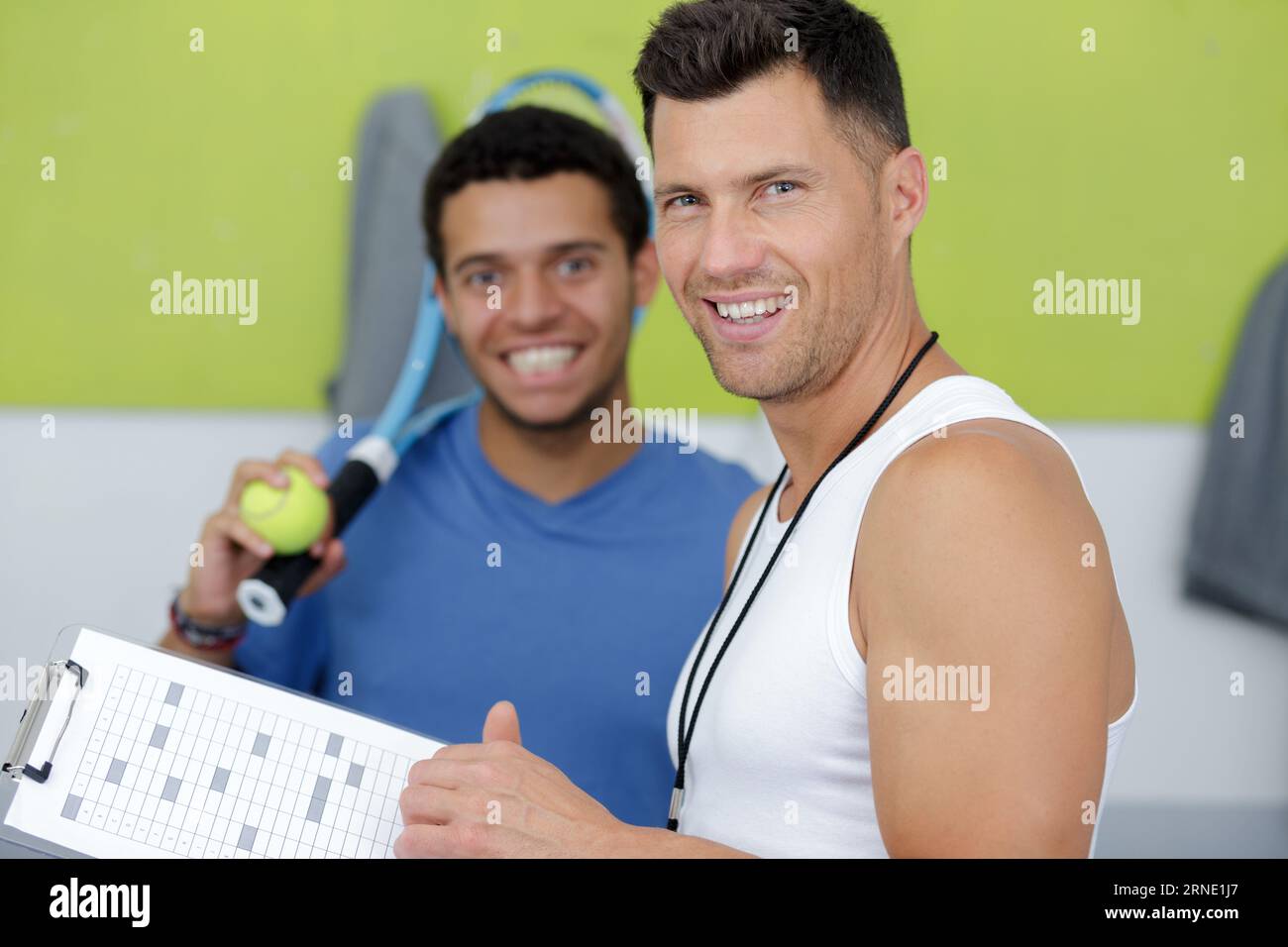 happy coach with tennis player Stock Photo - Alamy