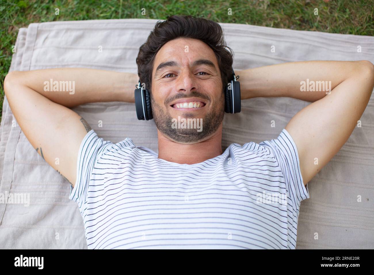 Handsome young man earplugs hi-res stock photography and images - Alamy