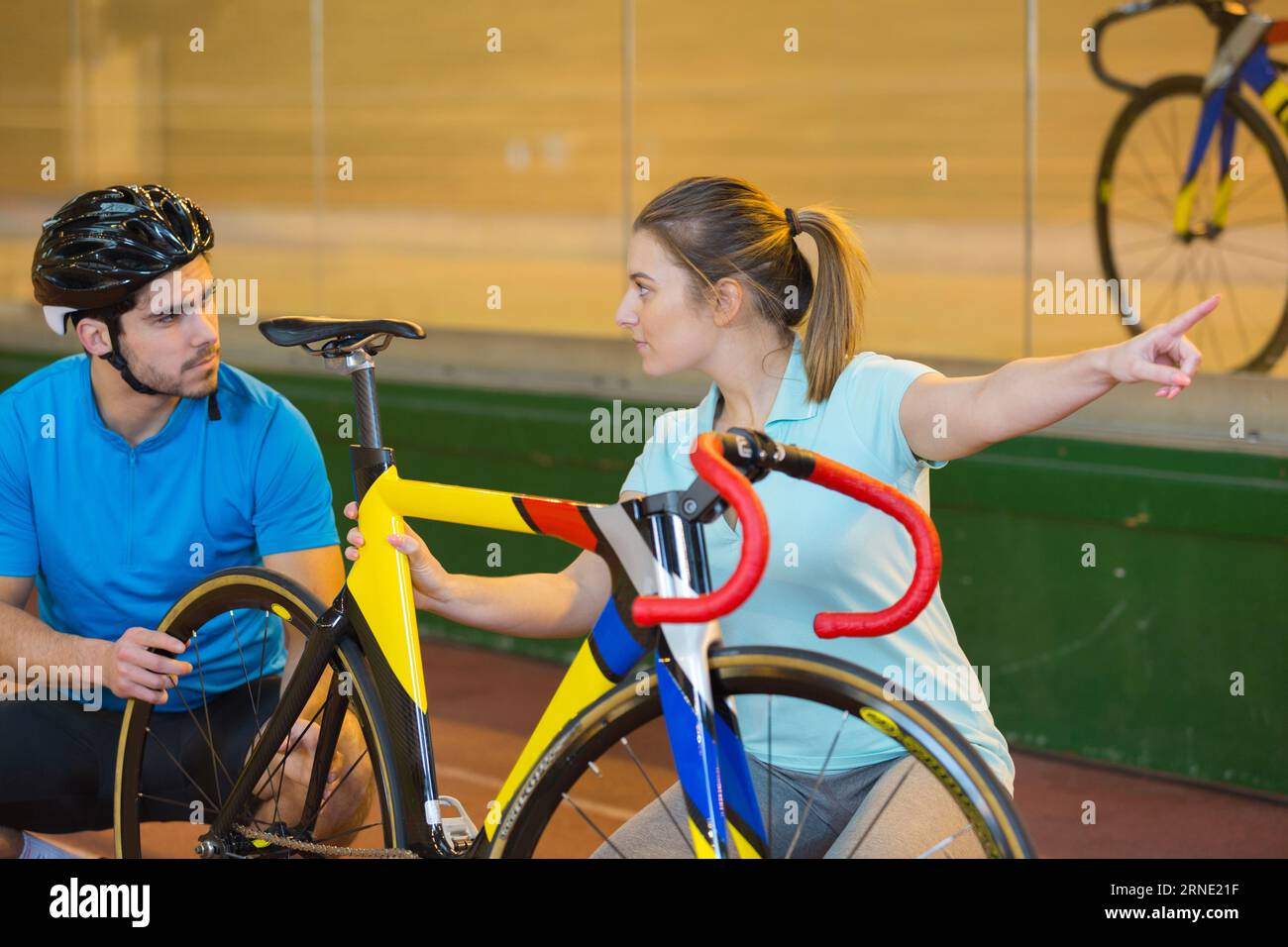 female coach pointing at velodrome Stock Photo - Alamy