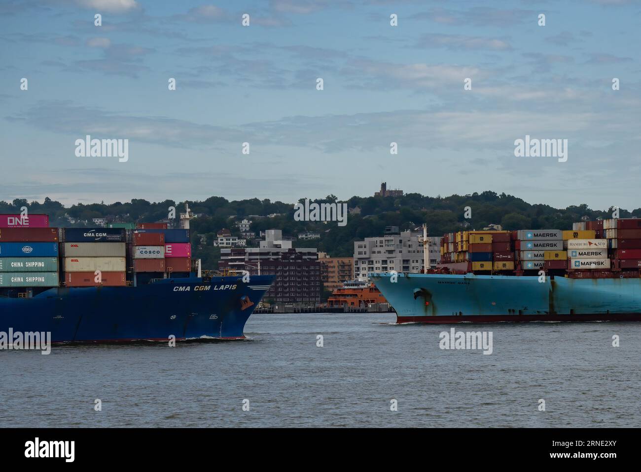 New York, USA - July 21st, 2023: Two cargo ships, loaded with ...