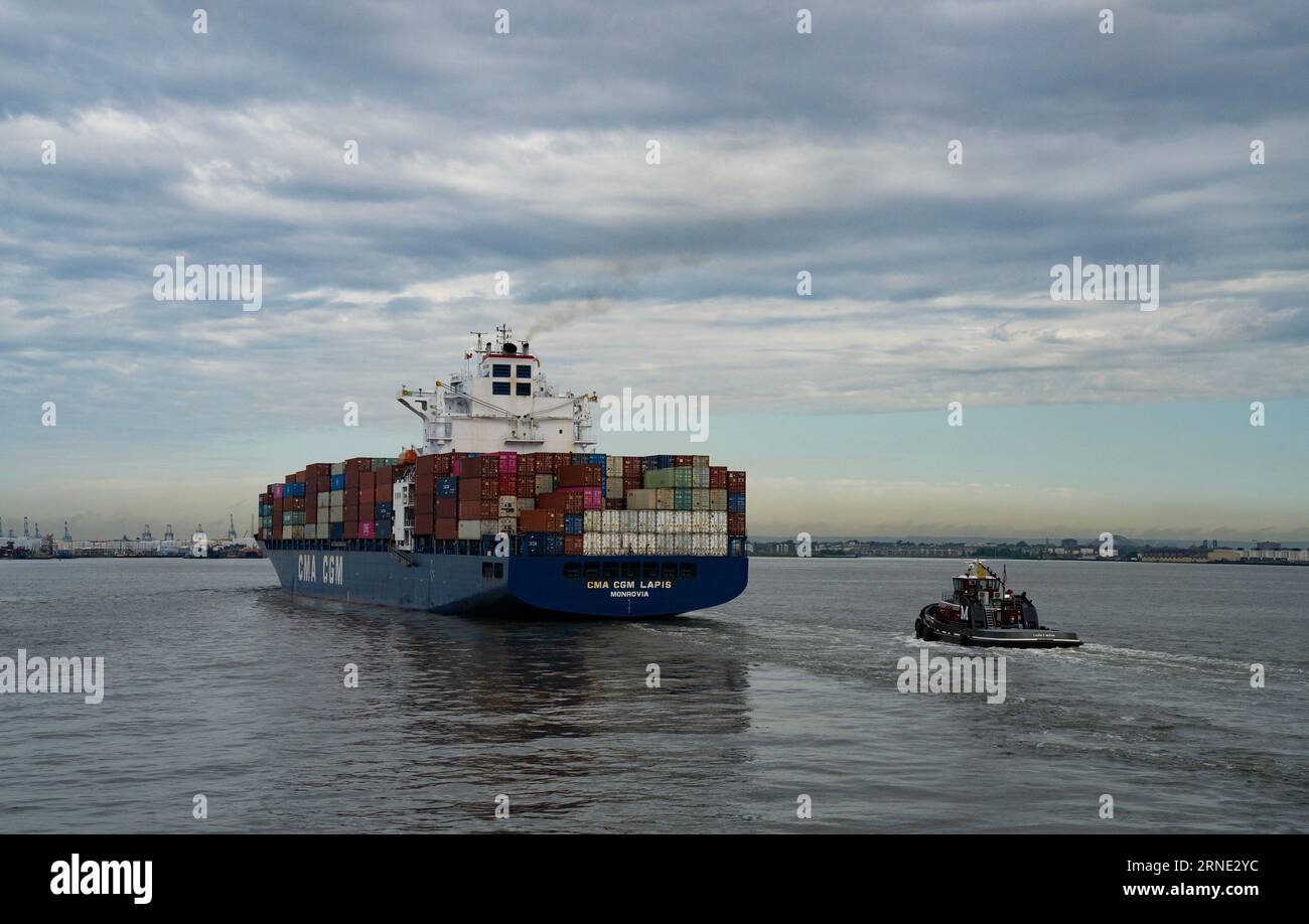 New York, USA - July 21st, 2023: A cargo ship, loaded with containers ...