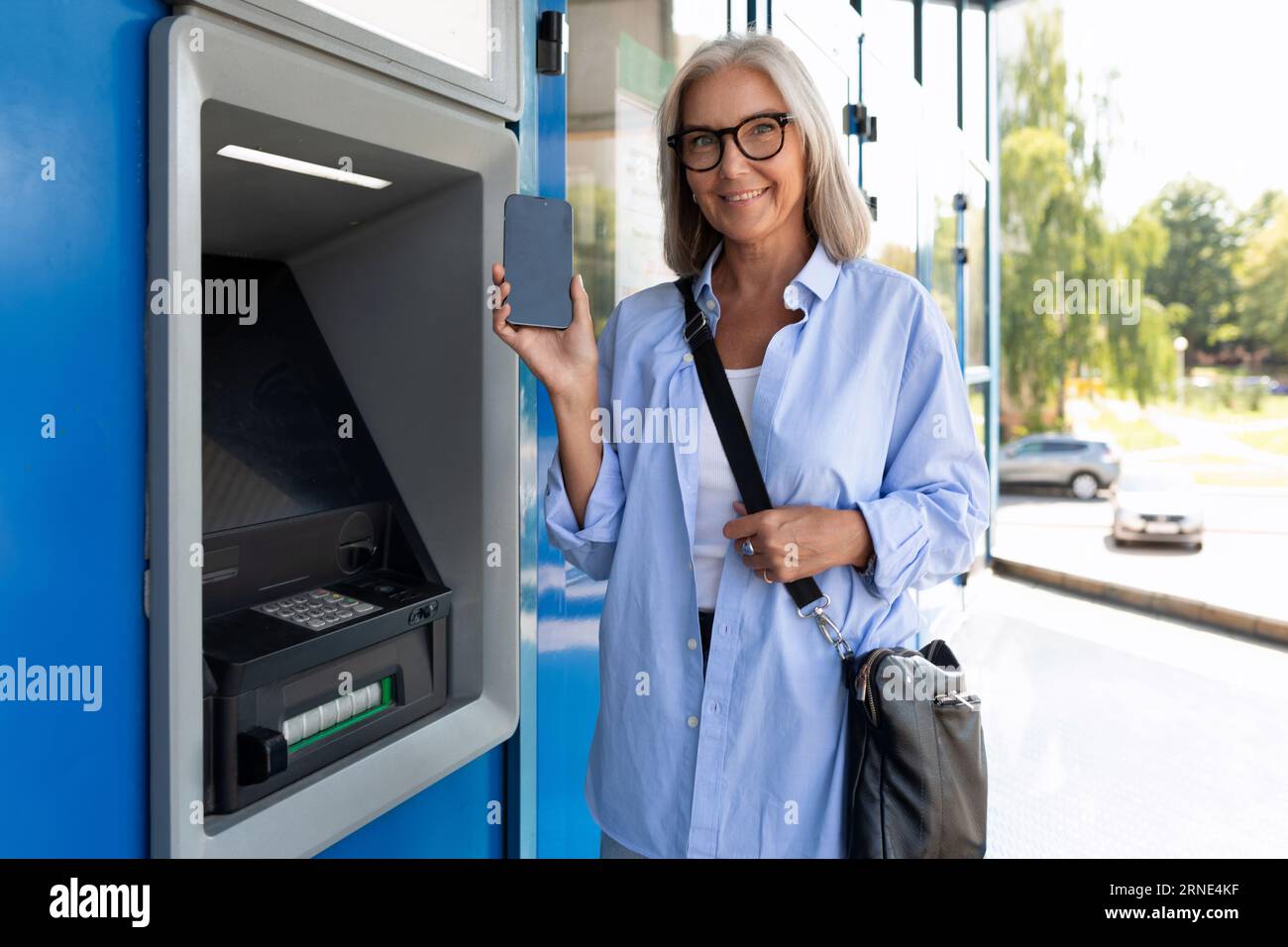 Mature woman typing bank card hi-res stock photography and images - Alamy