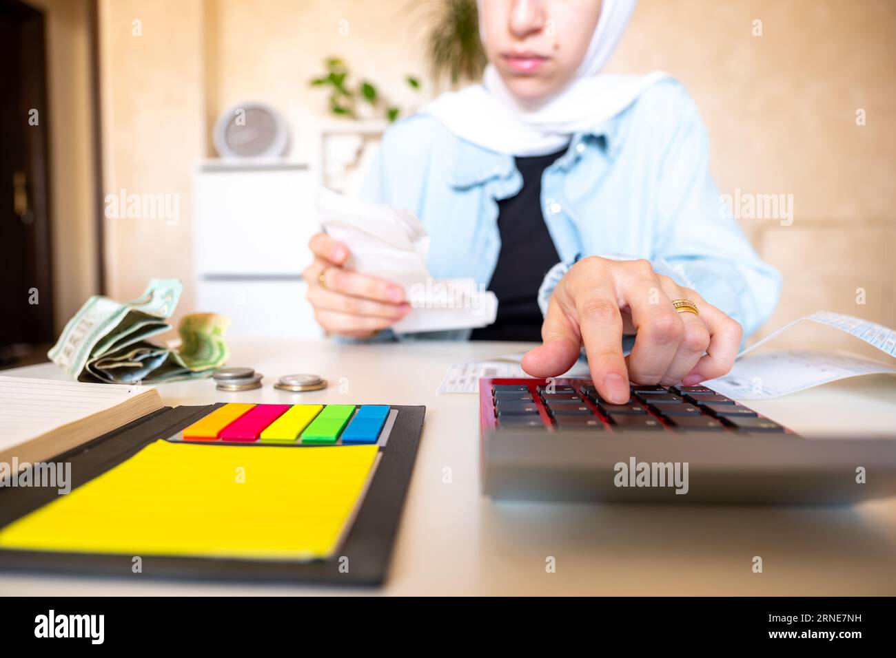 Young man counting money sitting hi-res stock photography and images ...