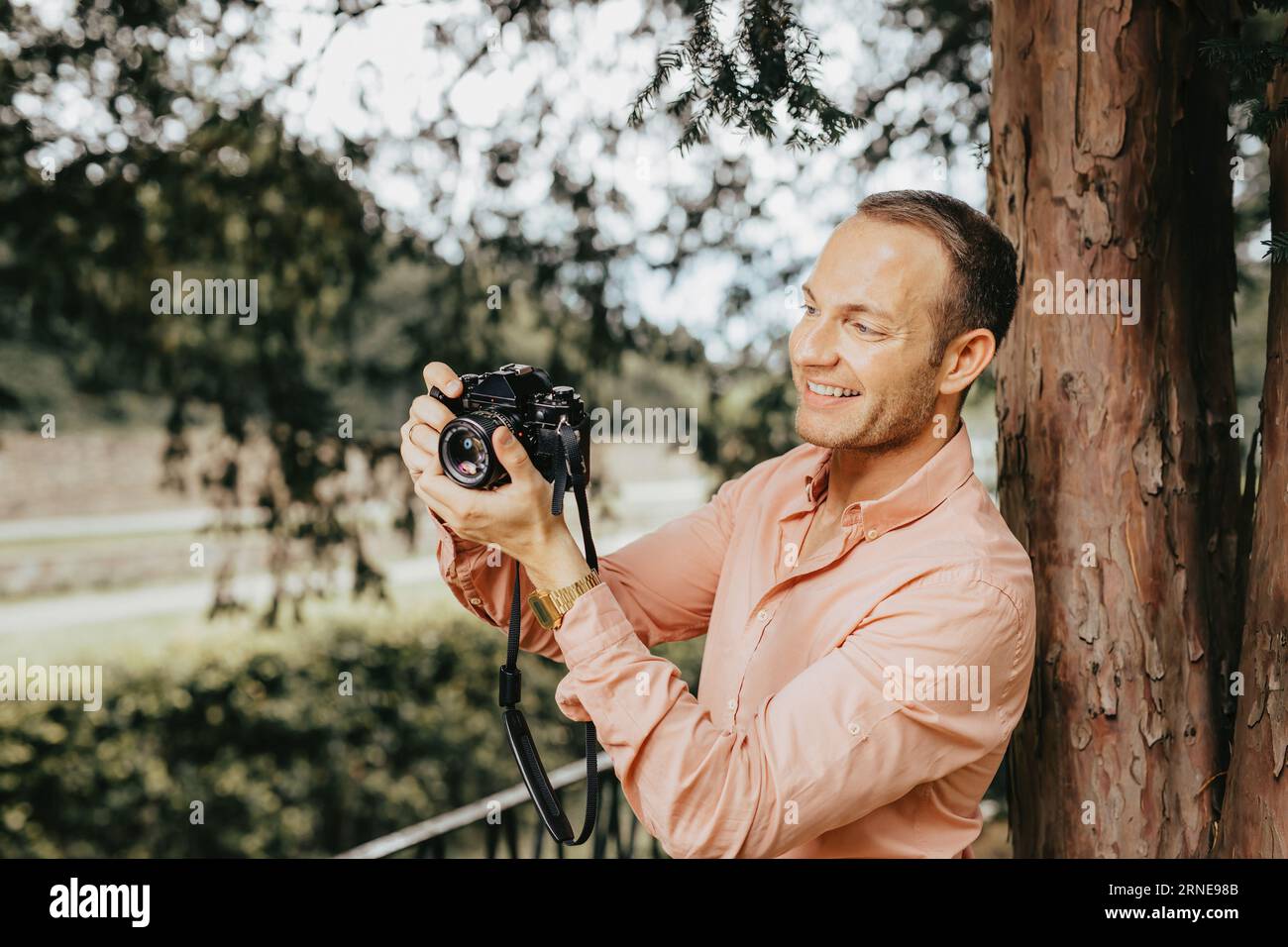 photographer with retro camera take picture with his vintage machine ...