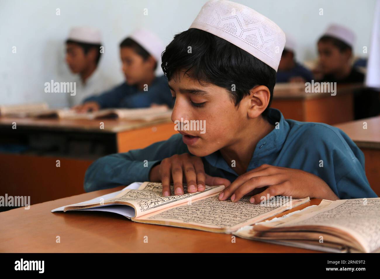 Learning quran hi-res stock photography and images - Alamy
