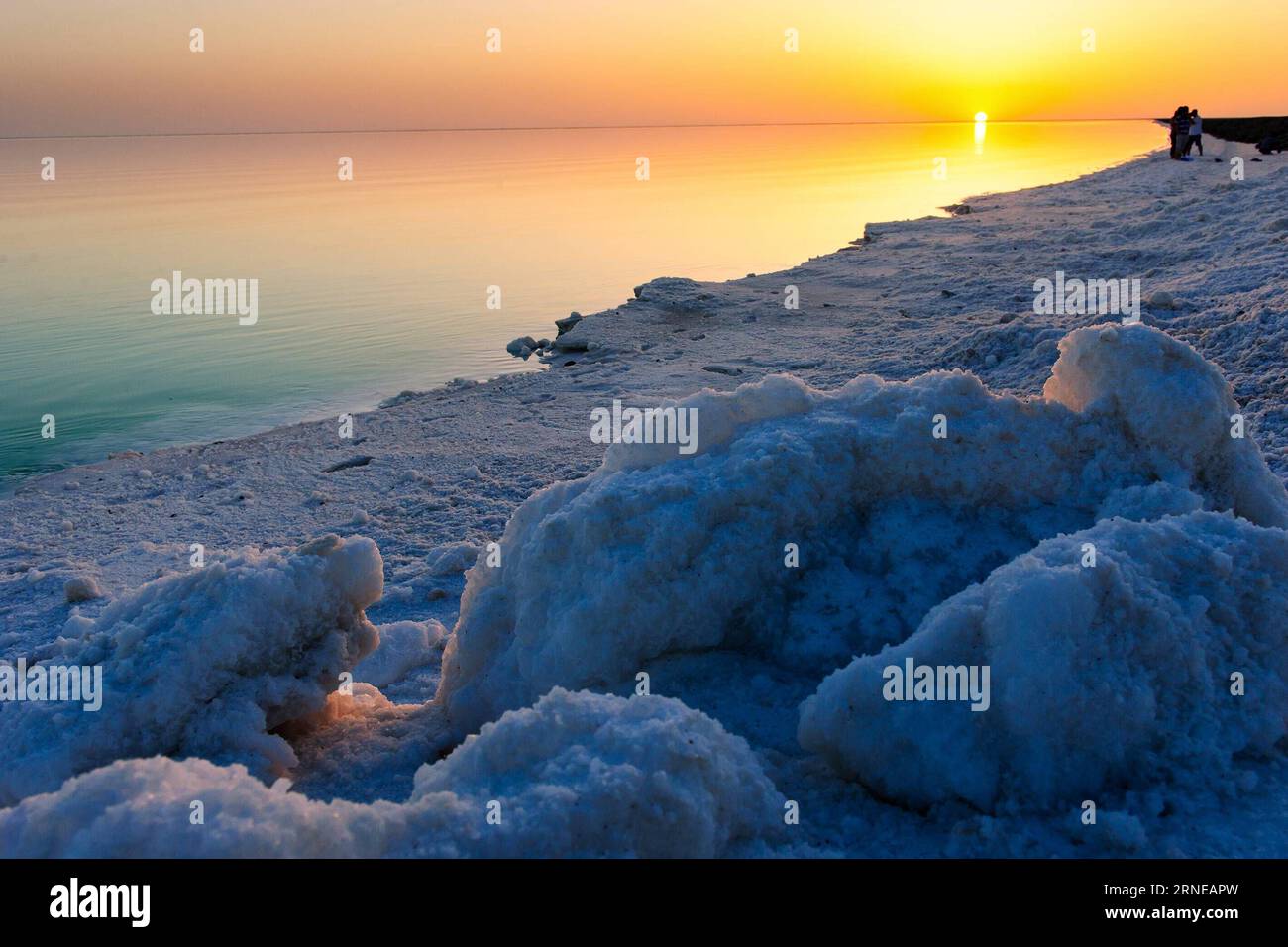 Photo taken on June 15, 2016 shows the sunset scenery of a salt lake in ...