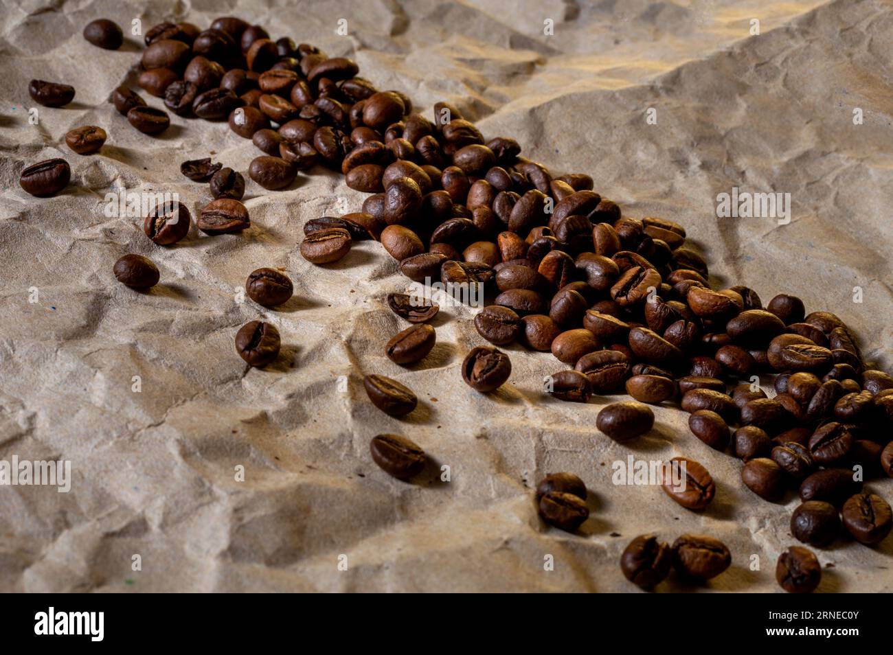 Roasted coffee beans on a paper background Stock Photo - Alamy