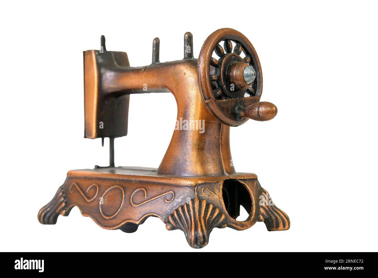 Small souvenir object of a sewing machine. Object isolated in white ...