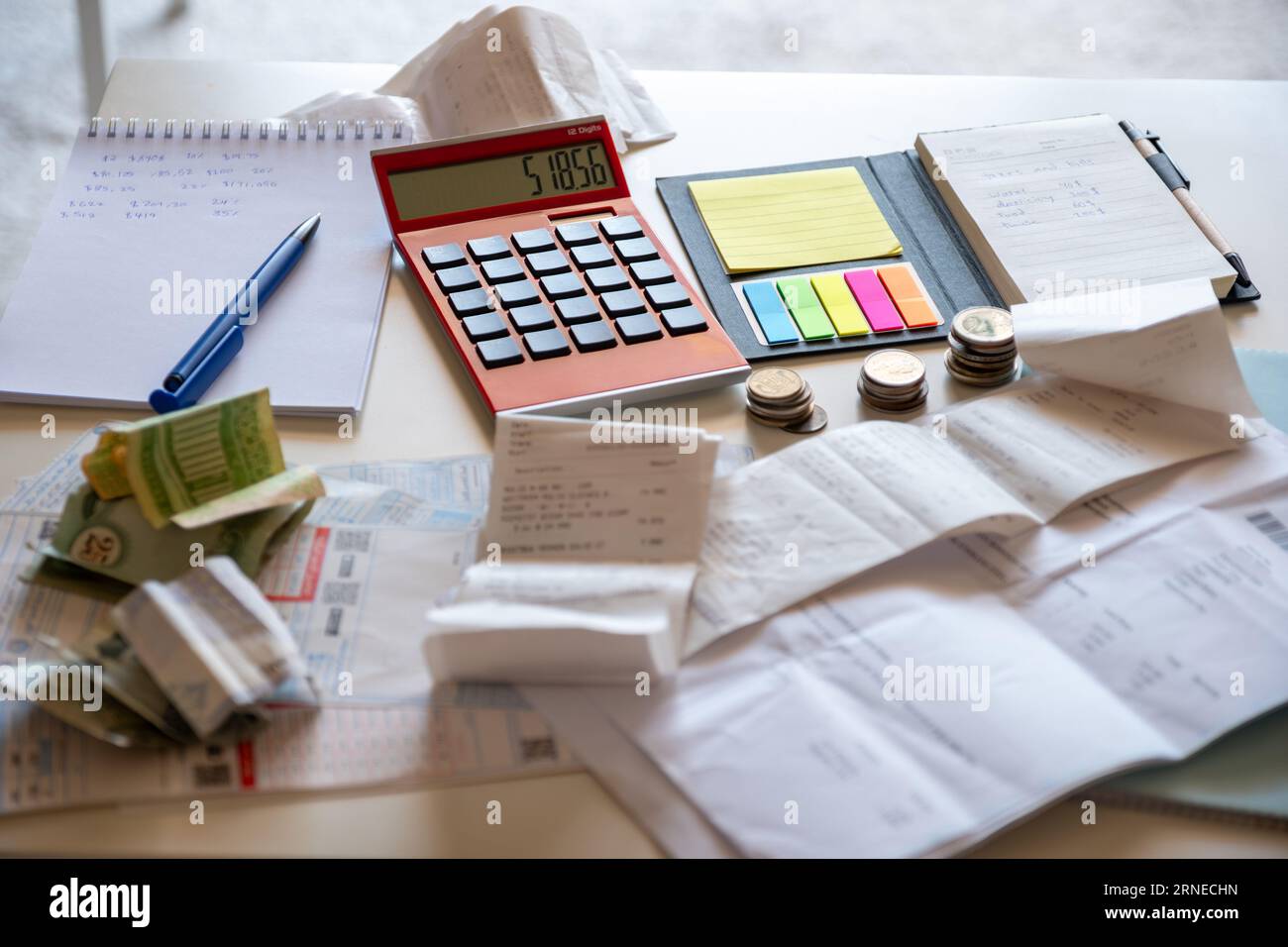 Table consist of money bills represents the costs of living Stock Photo ...