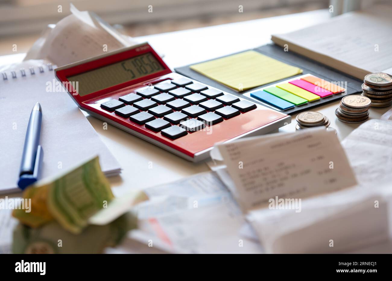 Table consist of money bills represents the costs of living Stock Photo ...