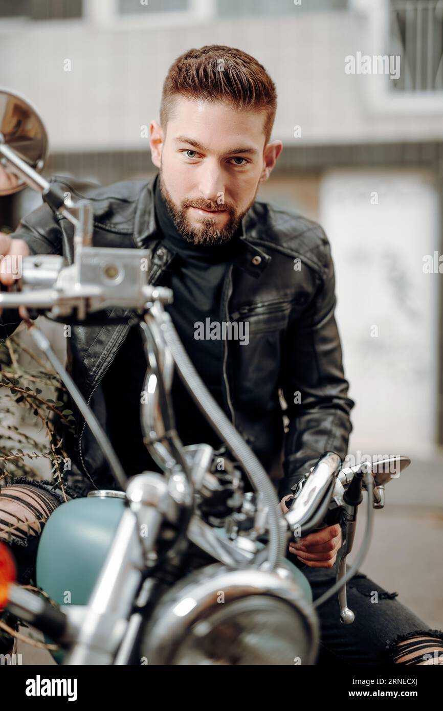 handsome macho motorcyclist sit on chopper while being hot and stylish ...