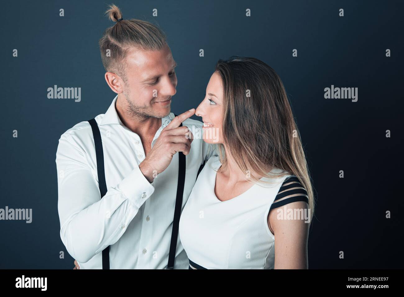 young sensual couple is lost in their own world of love and desire when ...