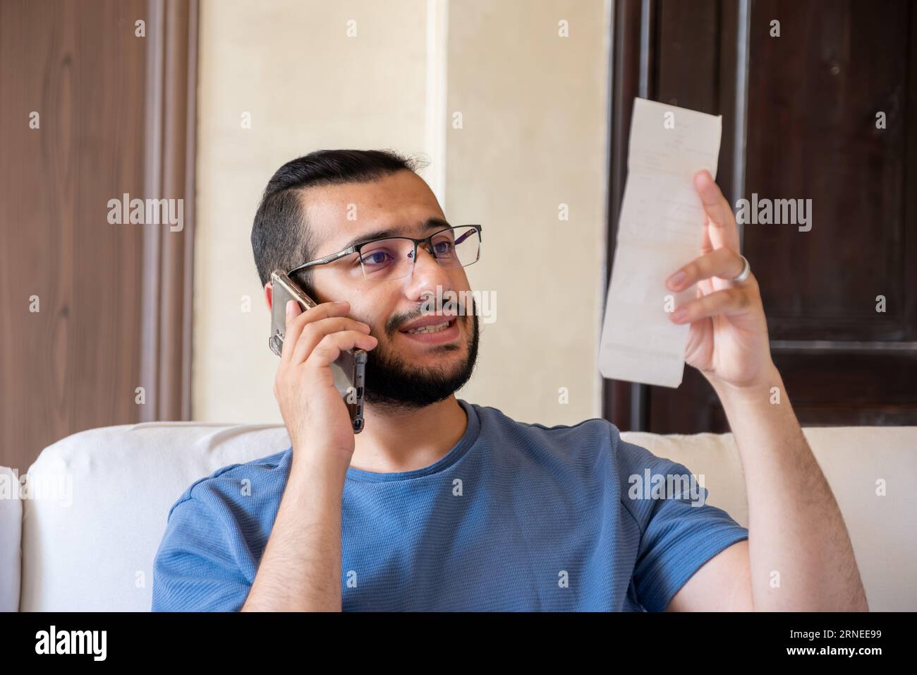 Closeup young man making payment hi-res stock photography and images ...