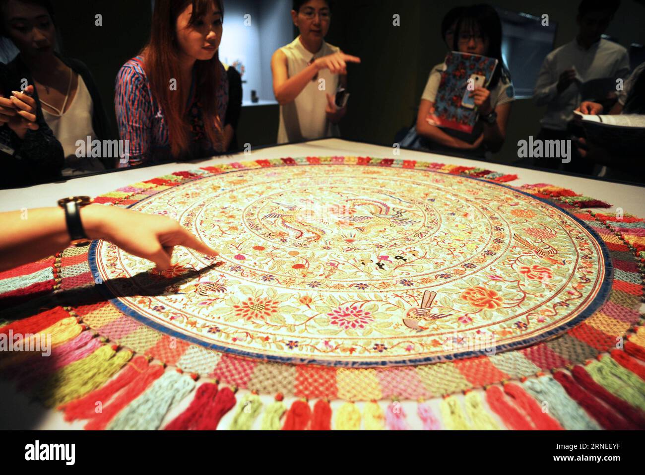 (160621) -- SINGAPORE, June 21, 2016 -- People look at a piece of ...