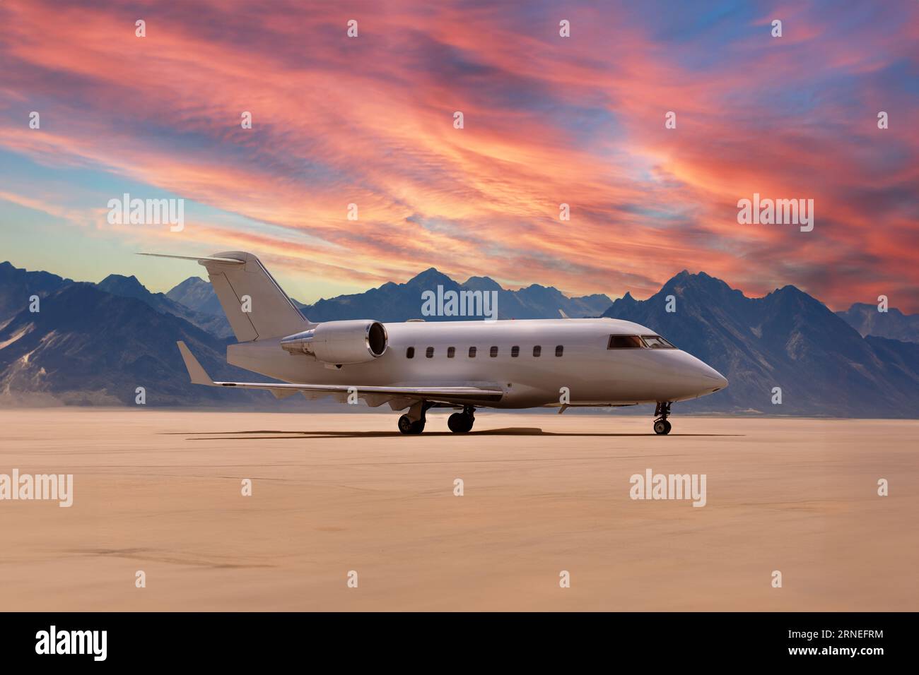 luxury private jet park on ground in desert with mountains in ...