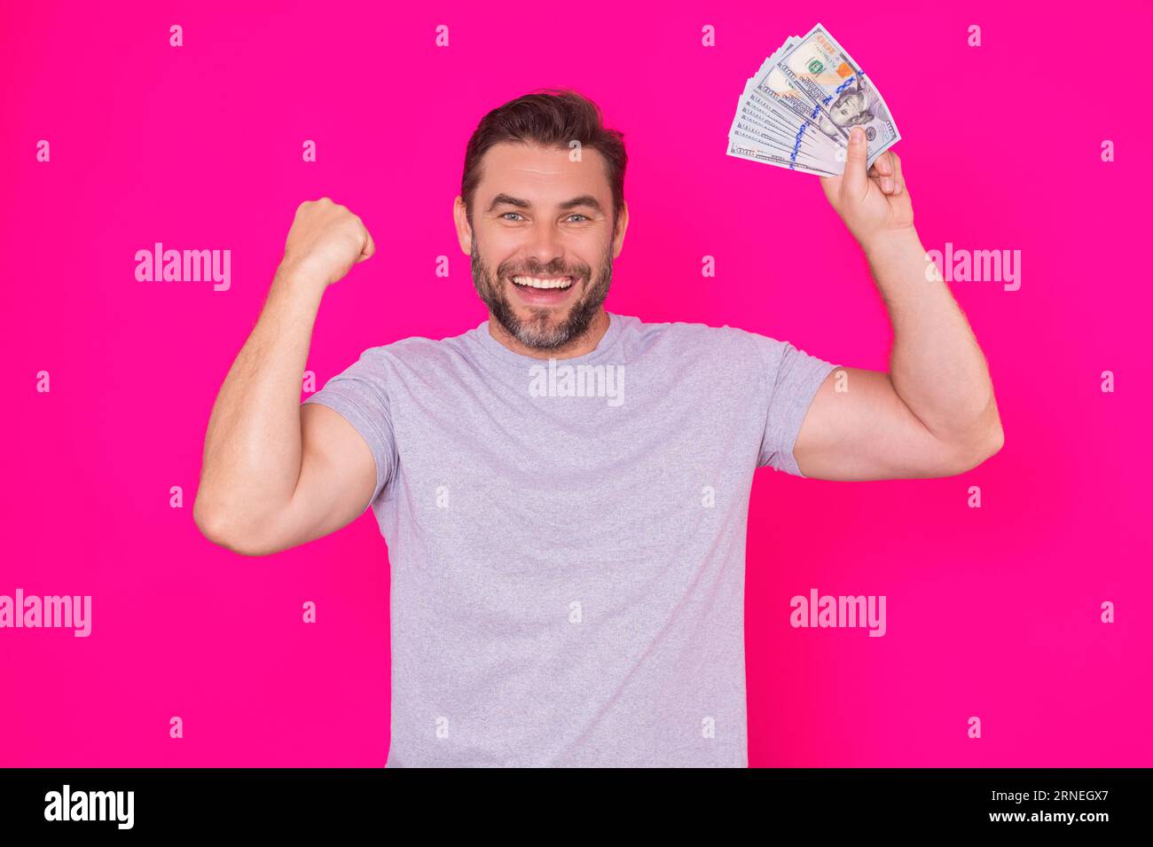 Middle aged hispanic man holding cash money in dollar banknotes on ...
