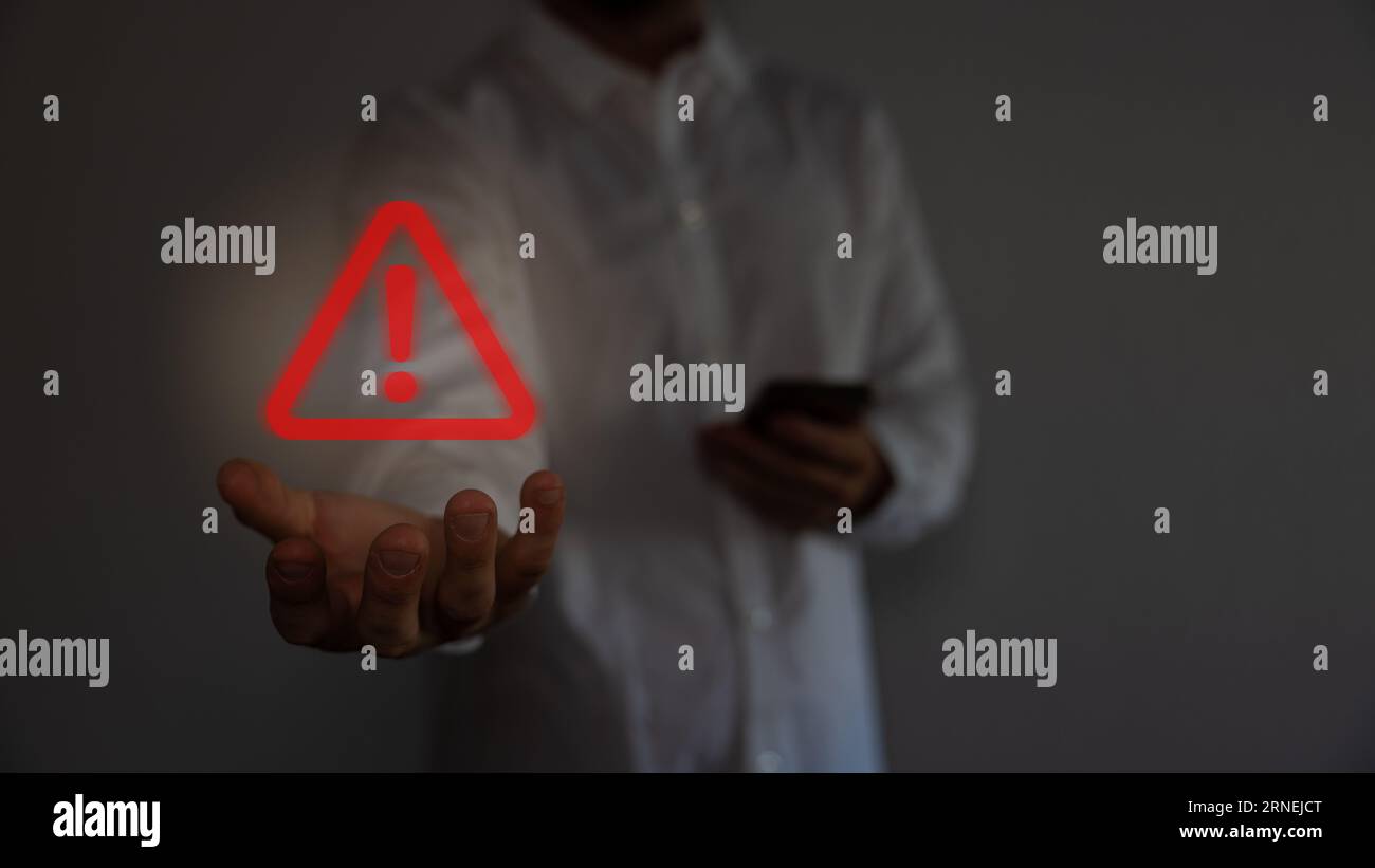 Hacking Concept. Attention warning attacker alert sign with exclamation mark on dark red ...