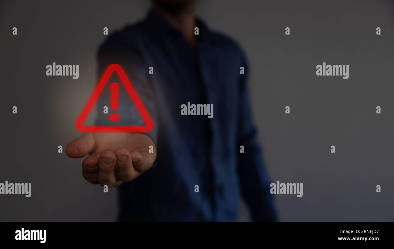 Hacking Concept. Attention warning attacker alert sign with exclamation mark on dark red ...