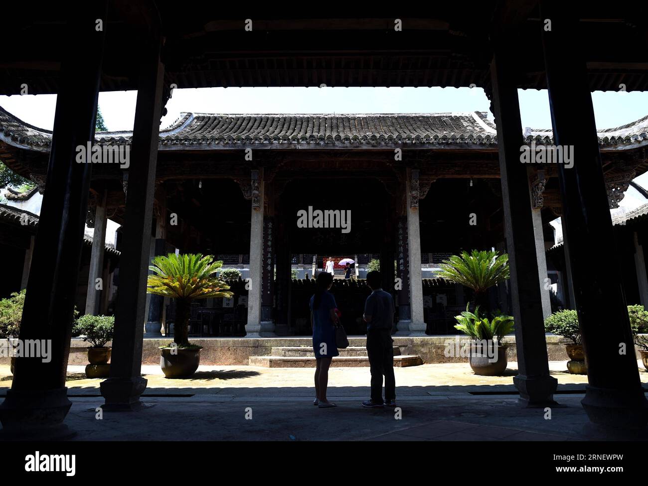 Tourists visit an ancestral hall in Zhuge Village in Lanxi City, east ...