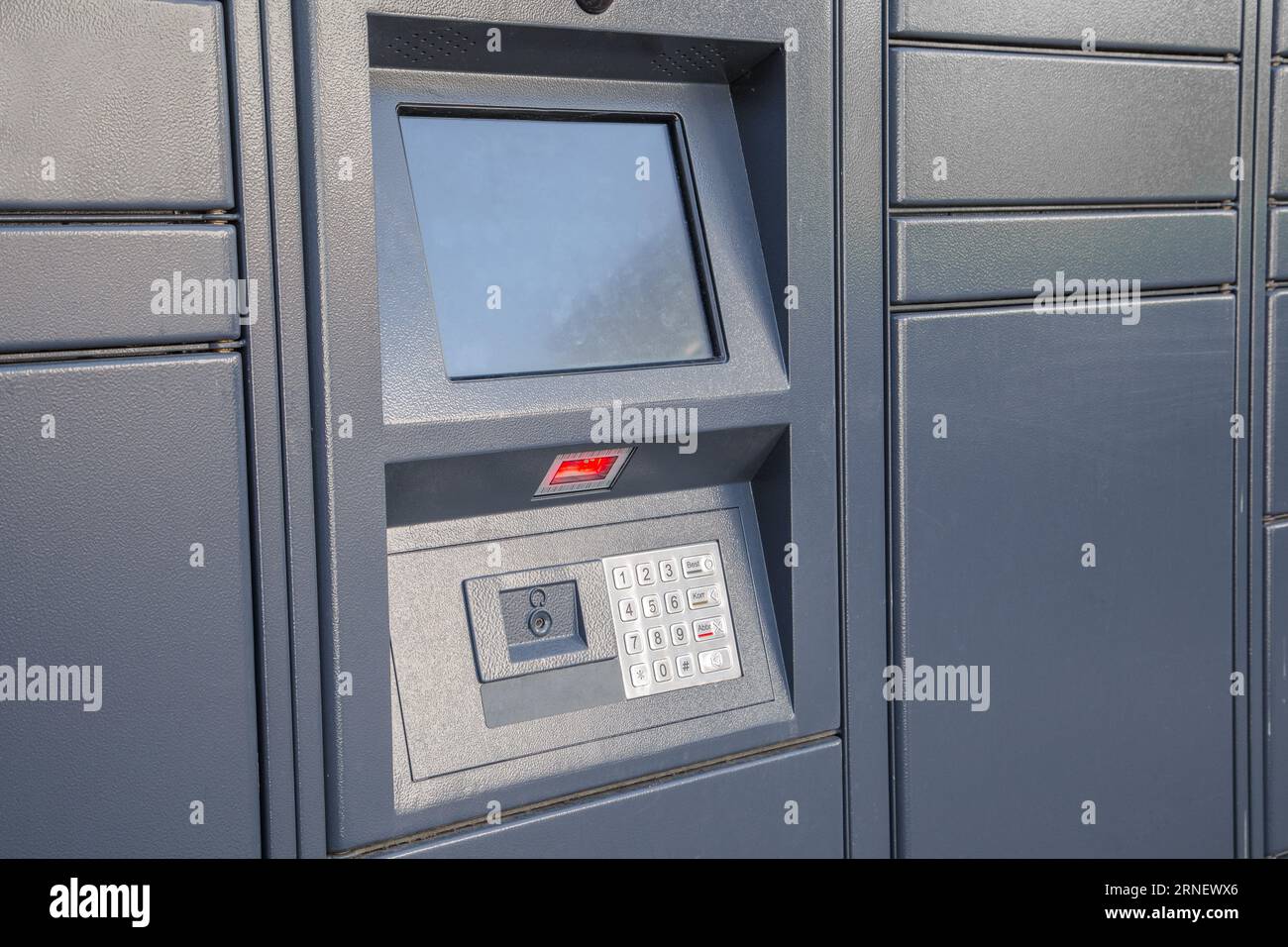 keypad with numbers and screen at parcel station similiar to atm and ...