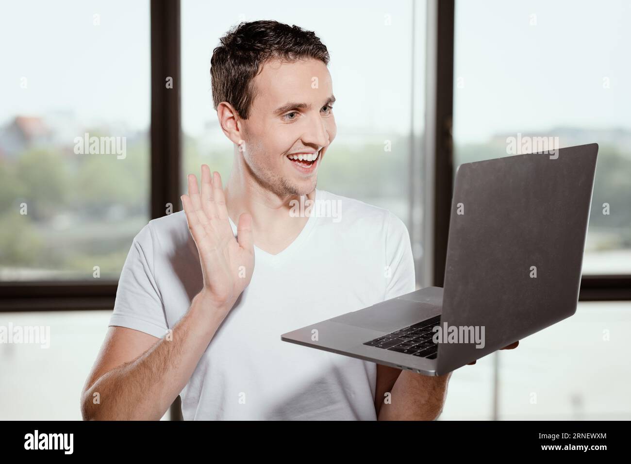 Businessman standing window looking distance hi-res stock photography ...