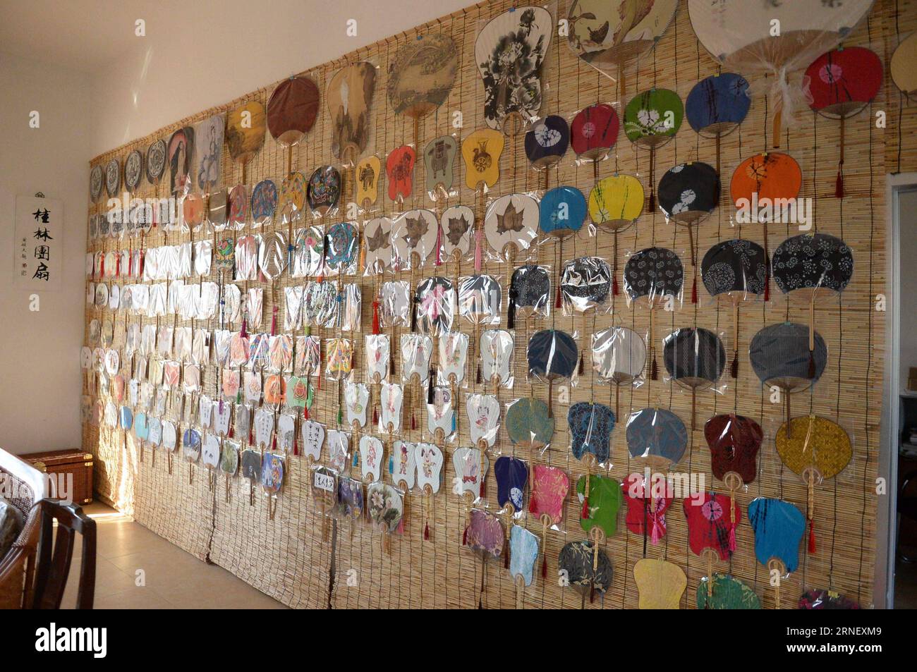 Photo taken on July 6, 2016 shows the moon-shaped fans made by folk ...