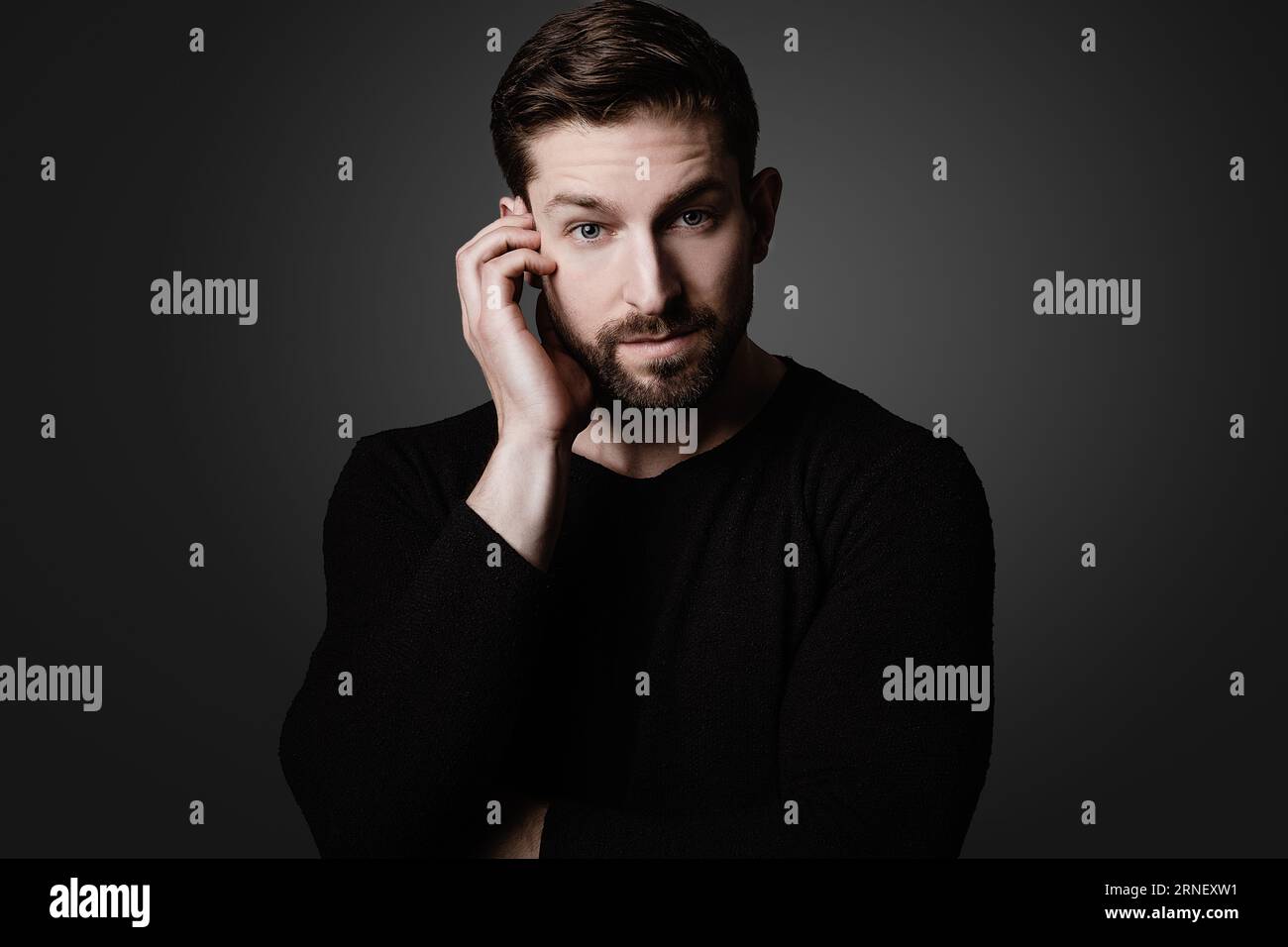 sceptical man with questioning face expression having hand on head and ...