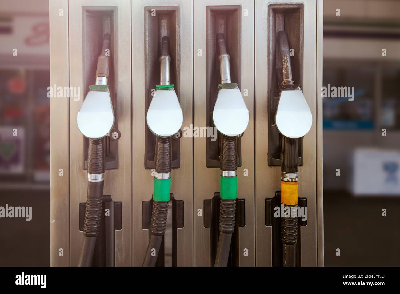 pump gas station with full nozzles to refill tank of car with gasoline ...