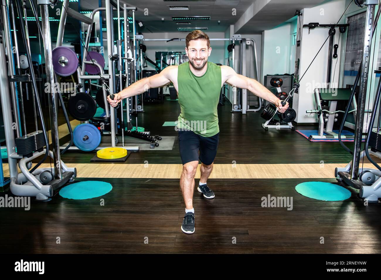 handsome muscular fitness guy trains at cable machine his triceps by ...