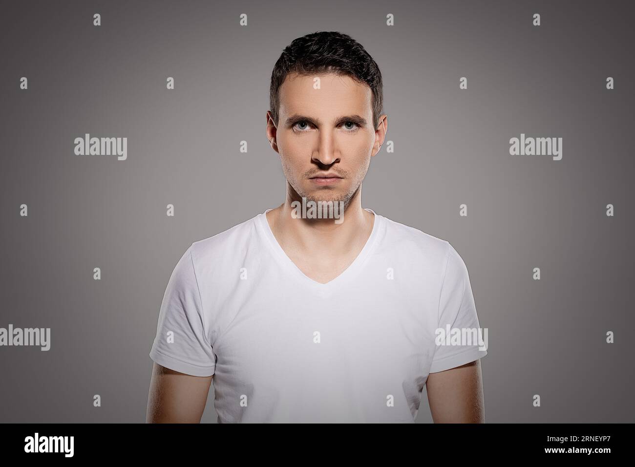 serious face expression of man while look at camera and show his inner ...