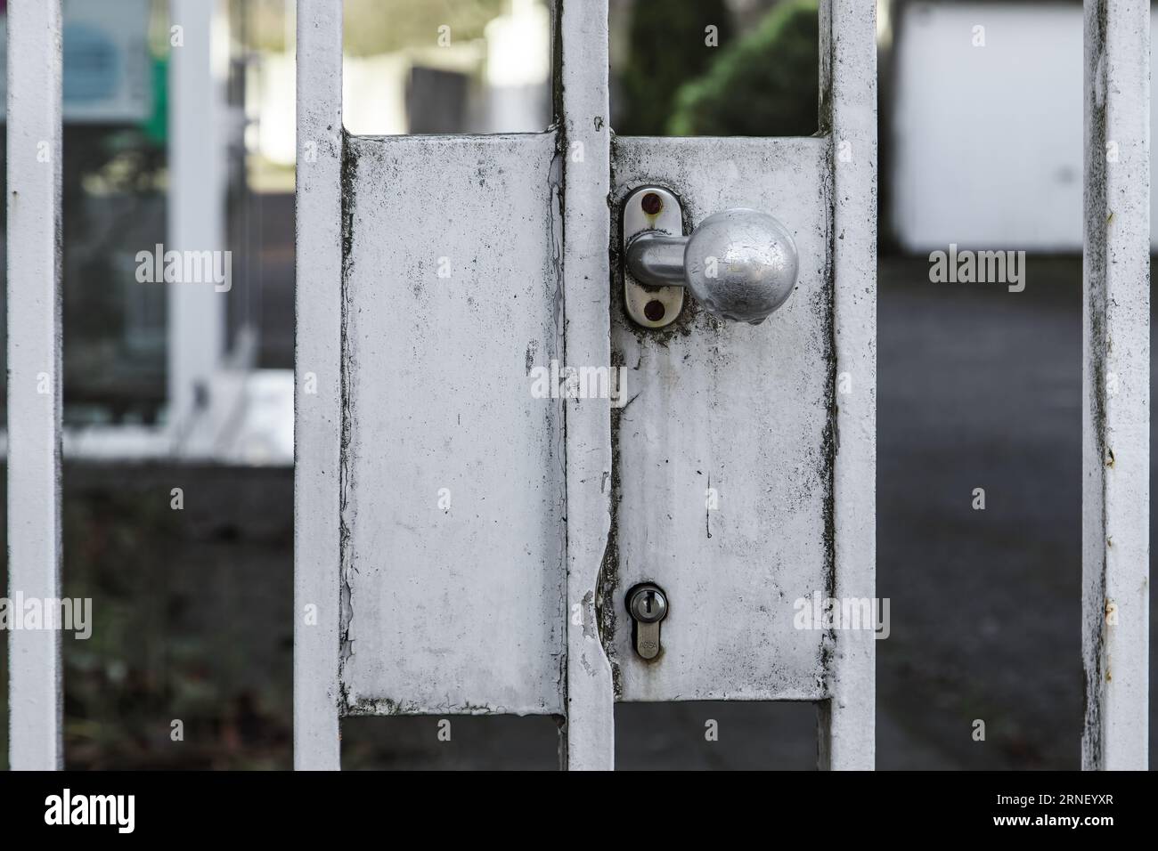 vintage old metal gate with stainless and rusty handle knob and lock is ...
