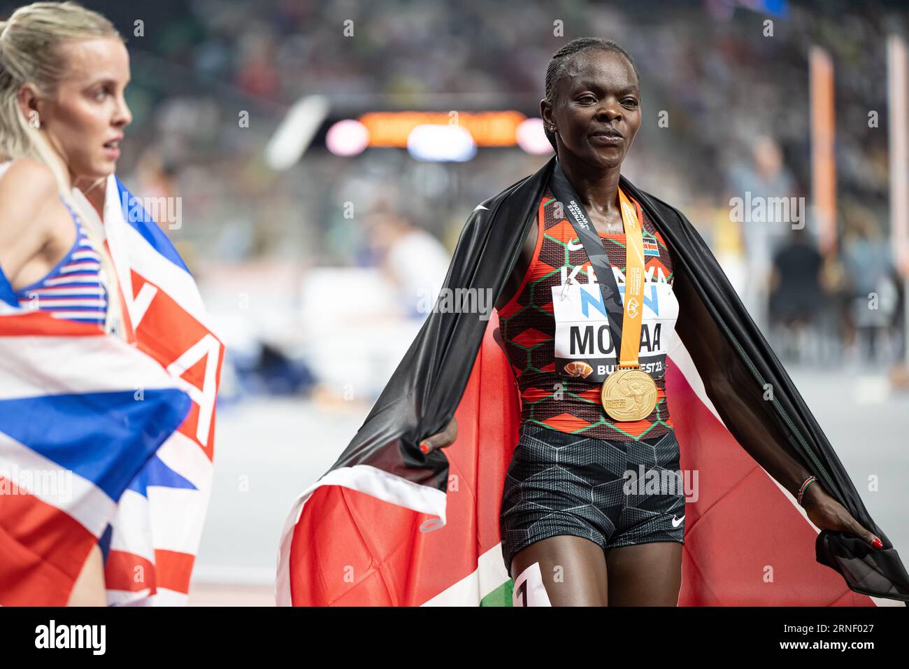 Mary Moraa celebrating her medal with her country's flag in the 800 ...