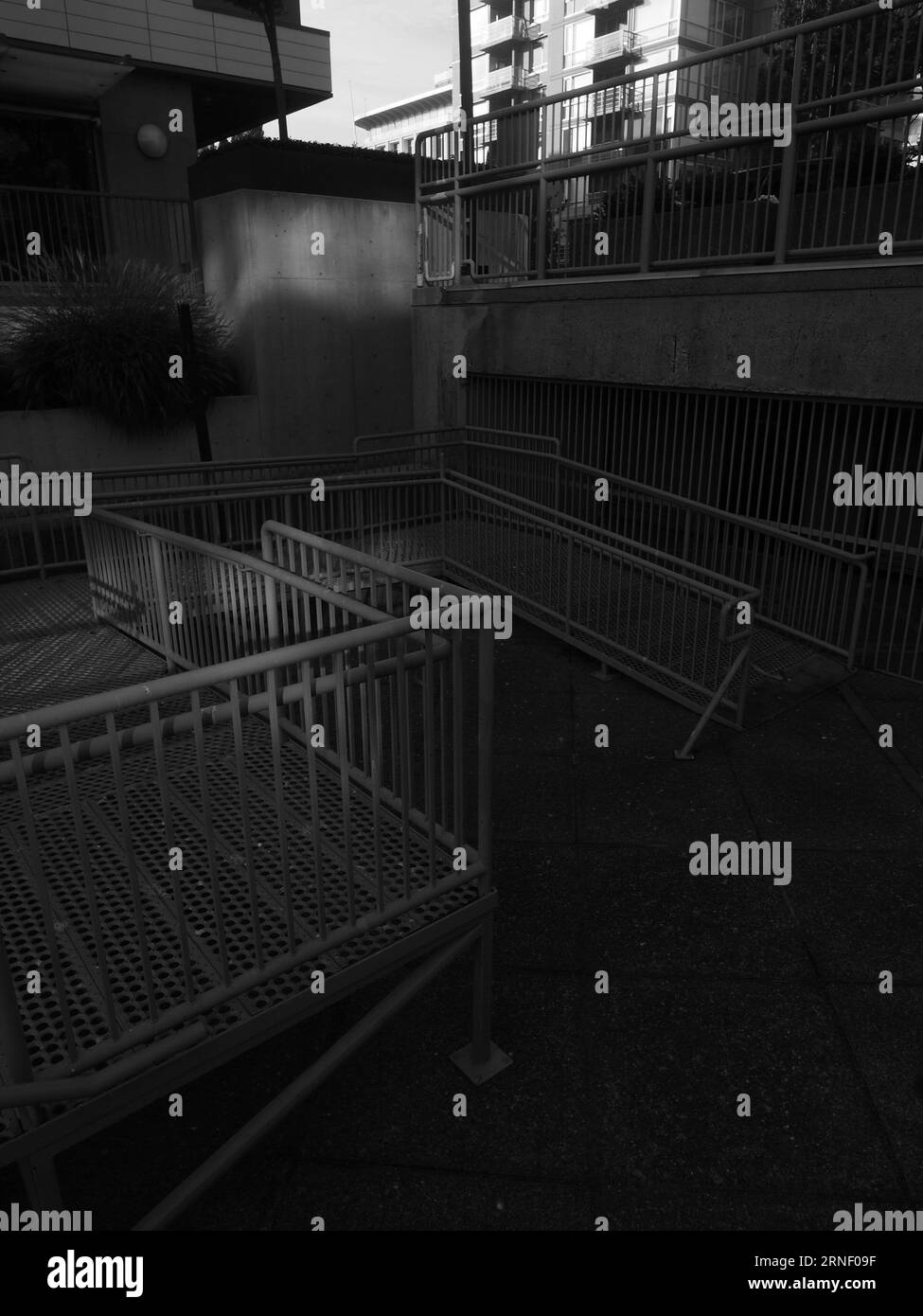 Concrete and steel alleyway with ramp Stock Photo - Alamy