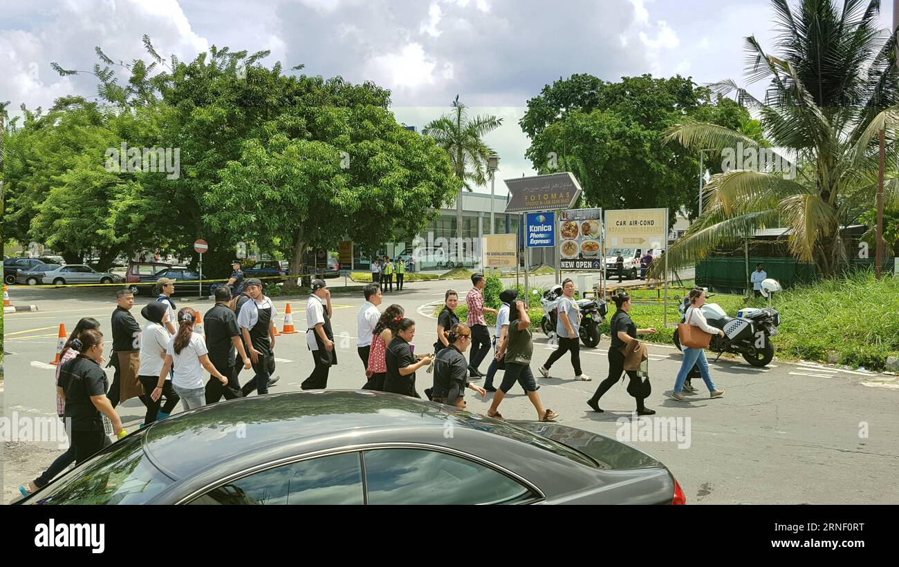 (160711) -- BANDAR SERI BEGAWAN, July 11, 2016 -- People in a ...