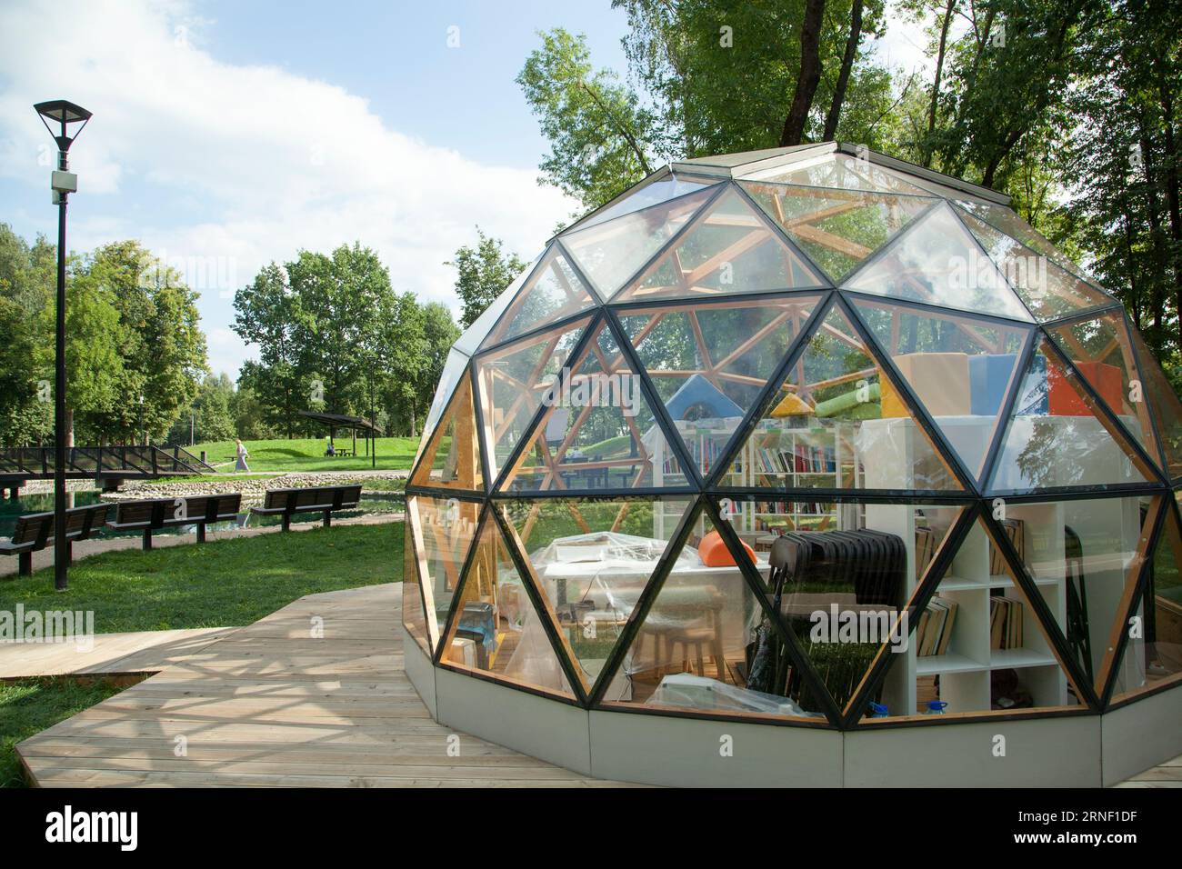 The glass covered tiny library inside the park in Kaunas city ...