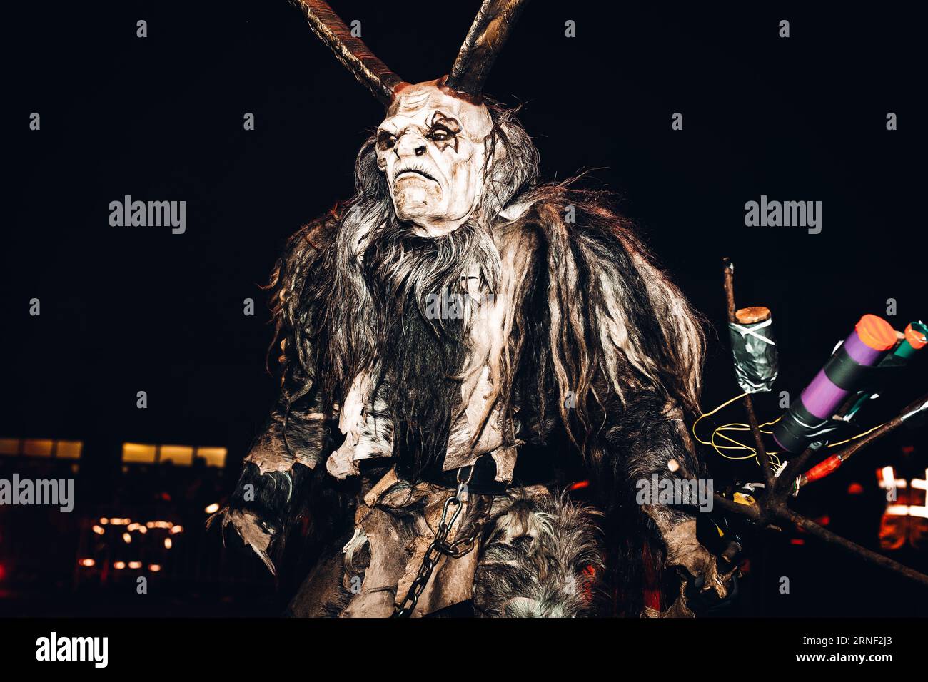 A person in a scary fantasy creature costume at a Halloween parade ...