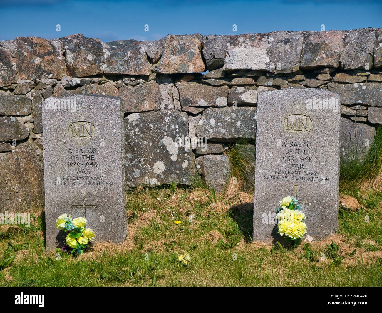 Two War Graves with flowers of unknown sailors of the merchant navy who ...