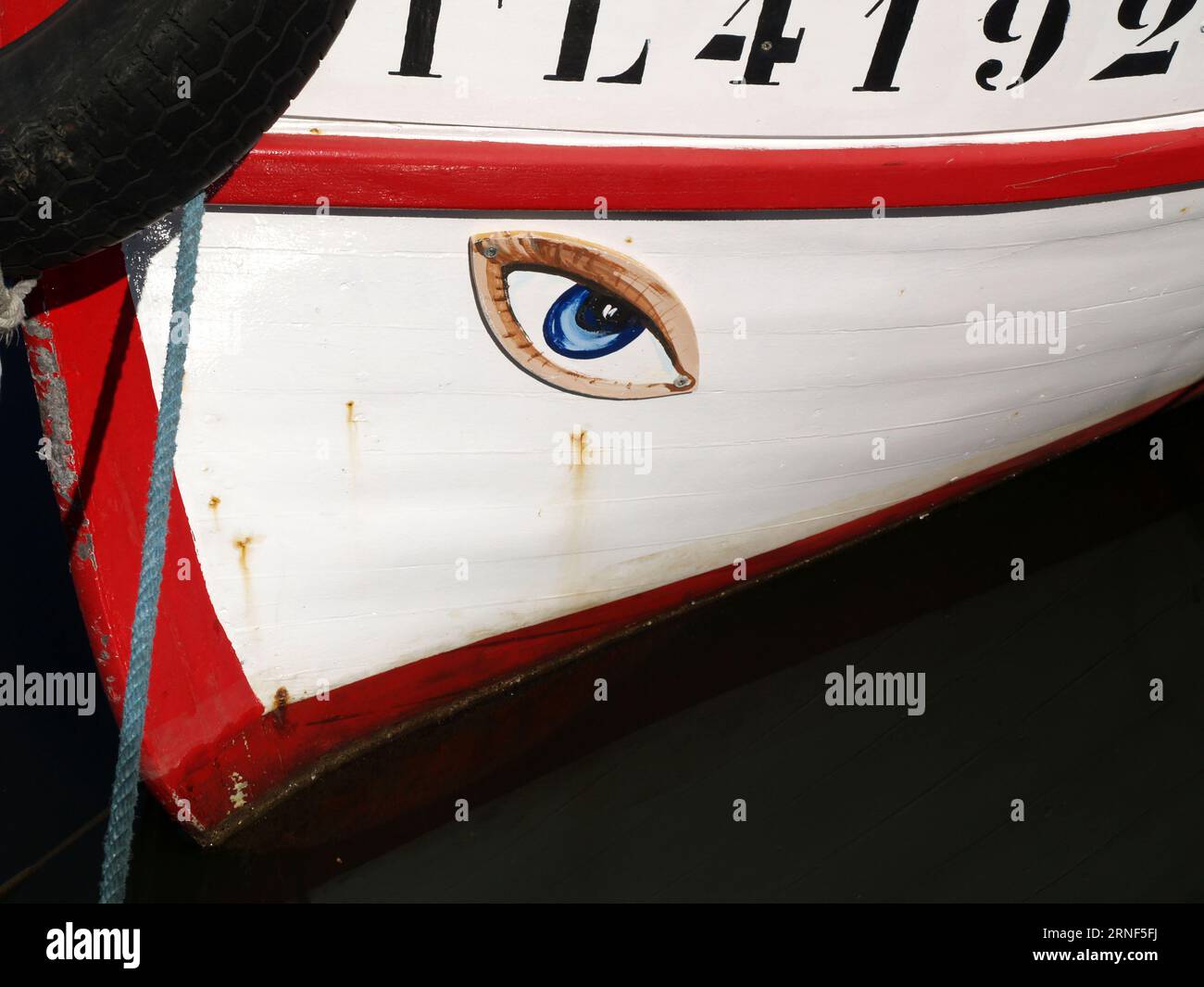 Local fishing boat decorated with a with a lucky eye Stock Photo - Alamy