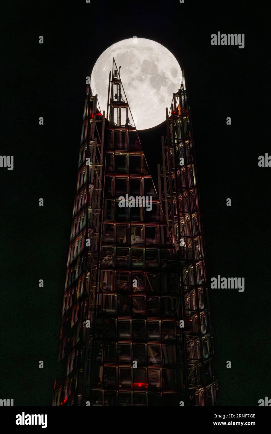 Blue super moon rises over The Shard in London. A ‘blue’ moon refers to ...